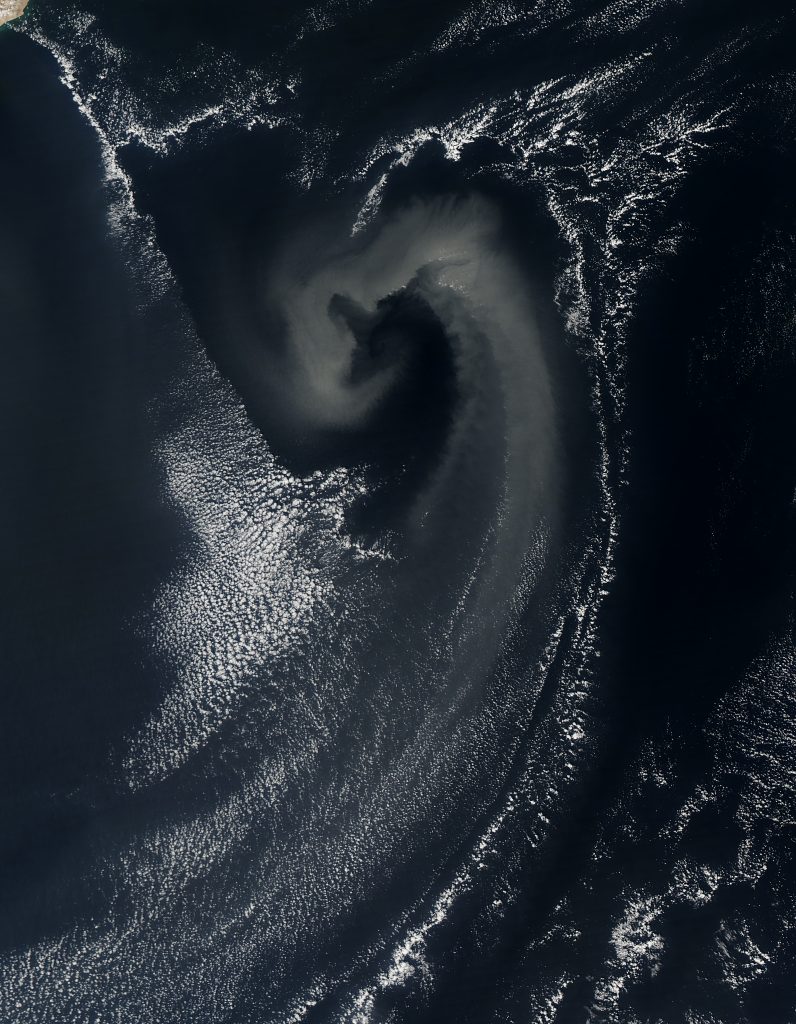 Vortex of dust and clouds spinning over the Arabian Sea - Earth.com