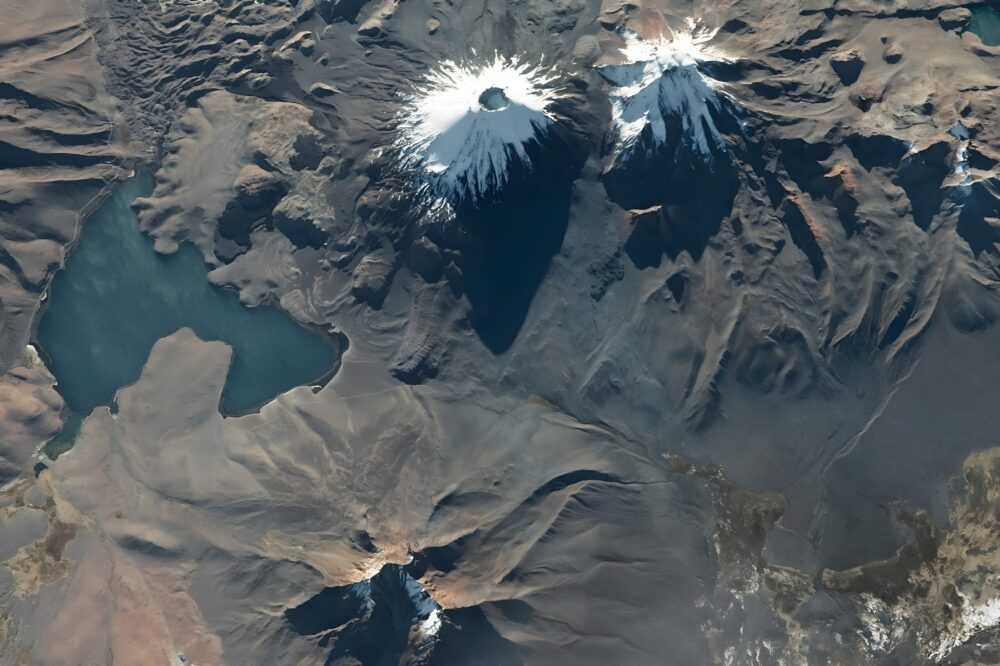 Twin volcanoes in the Andes Mountains • Earth.com