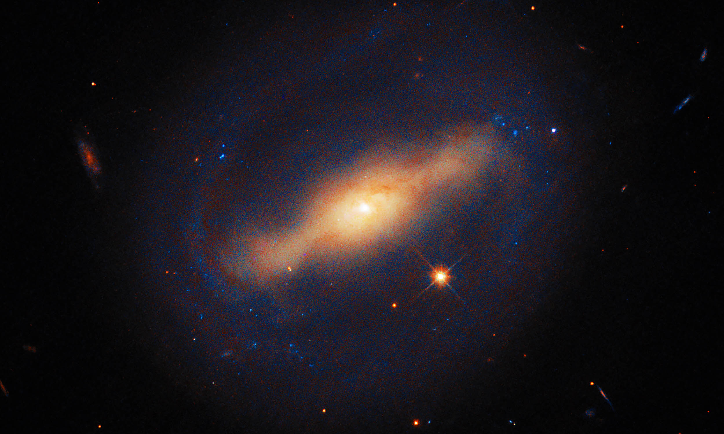 Galaxy resembling a Star Wars 'TIE fighter' captured by Hubble - Earth.com